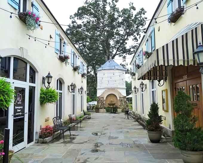 Twinkling lights overhead and cream-colored buildings create a French village square right here in Raleigh's backyard.