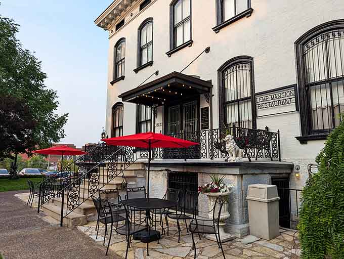 That charming patio with red umbrellas seems perfect for brunch, until you hear about the permanent residents upstairs.