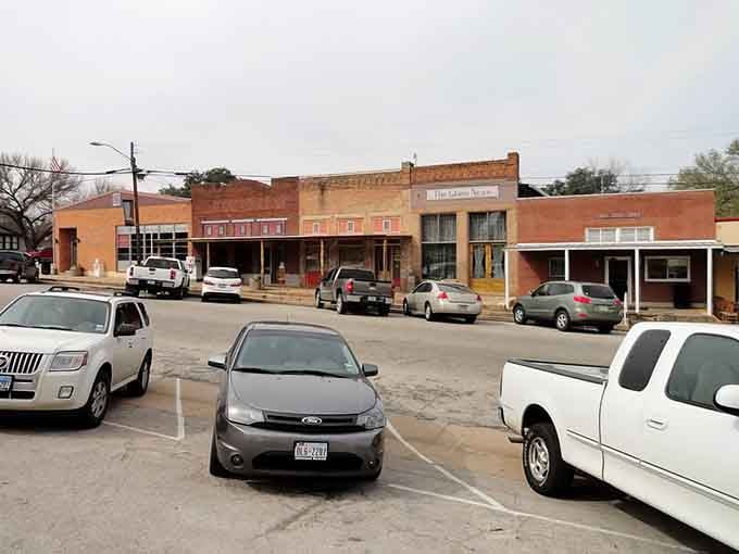 These storefronts have that lived-in look that says real people run real businesses here, not corporate headquarters.