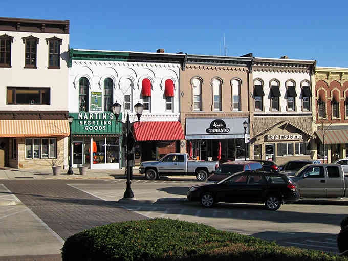 Those colorful awnings pop like candy against historic buildings that have stories older than your favorite sitcom.