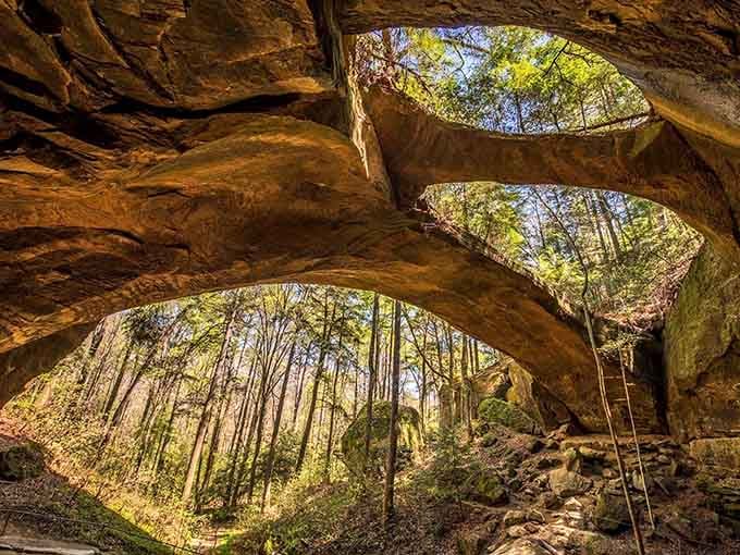 This natural stone bridge stretches overhead like something from a fairy tale, carved by patient water over countless years.