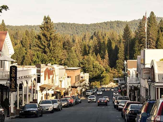 Pine-covered hills frame these historic balconies and colorful facades, where Gold Rush charm meets modern-day mountain town hospitality and warmth.