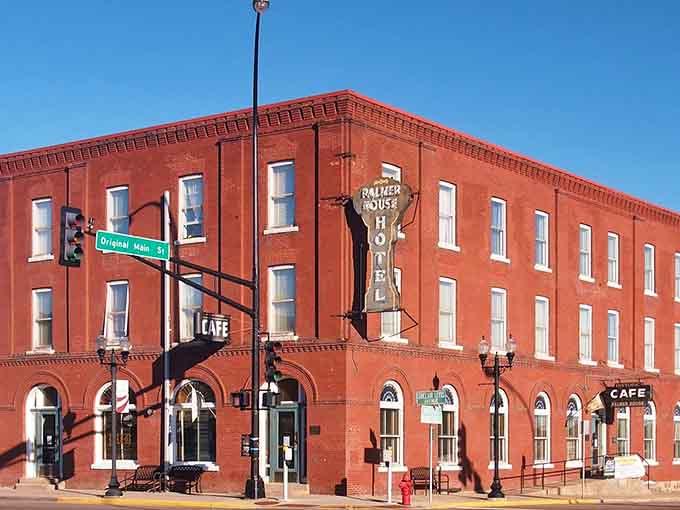 This red brick beauty stands proud on the corner, its vintage sign promising stories from another era.