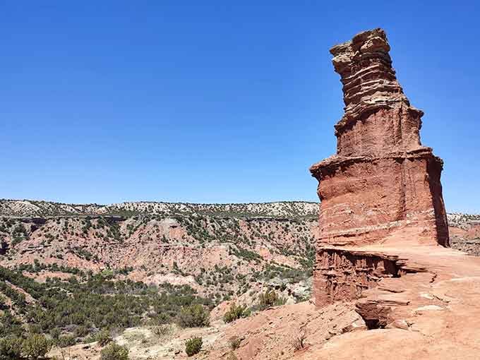 The Lighthouse formation stands like a rusty sentinel, watching over canyons painted in desert sunset colors.