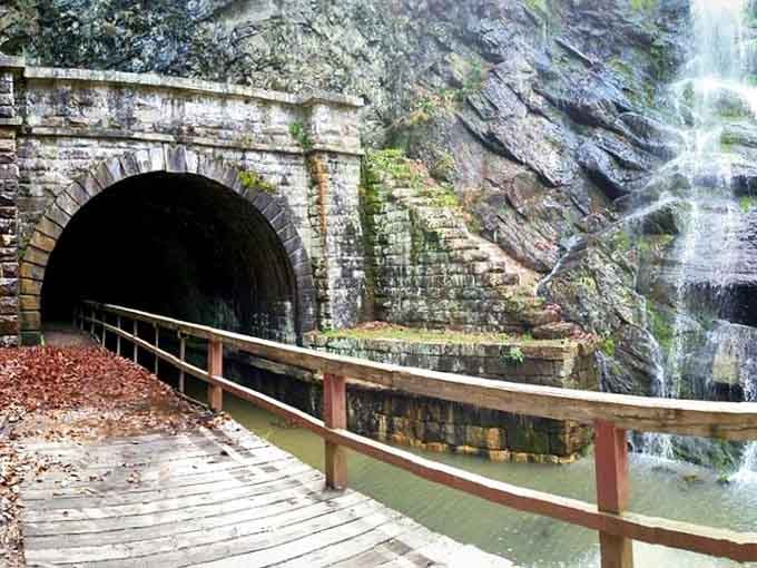 Walking through this brick tunnel feels like entering Narnia, except you emerge to waterfalls instead of talking lions.