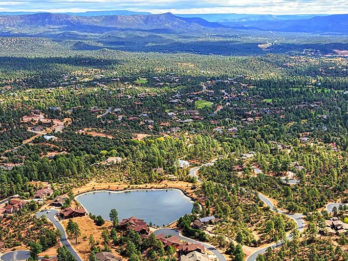 Nestled among ponderosa pines like a secret hideaway, this lake shimmers peacefully beneath the mountain sky.
