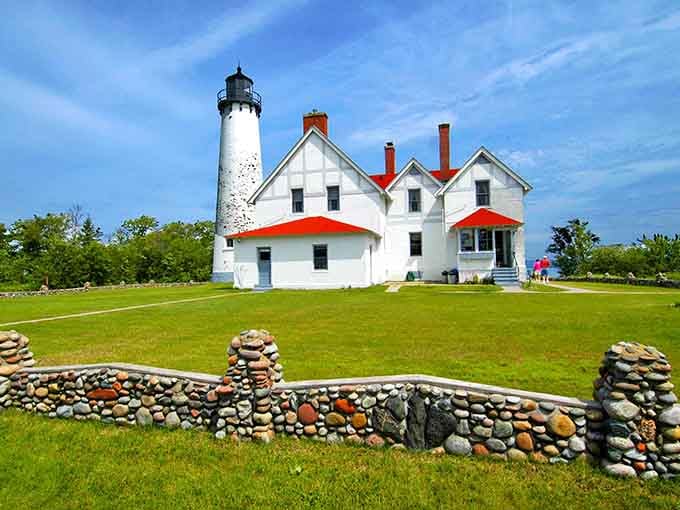 Those stone cairns in the foreground add a zen touch to this classic white lighthouse on emerald lawns.