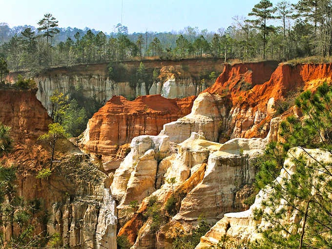 Mother Nature's paint palette went wild here, creating layers of orange, pink, and white like geological layer cake.
