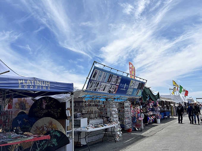 Those wispy clouds paint the sky while vendors display everything from keychains to kitchen gadgets below.