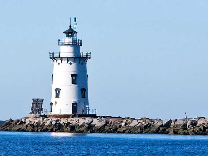 Crisp white paint and classic lines make this breakwater sentinel look like a postcard come to life.