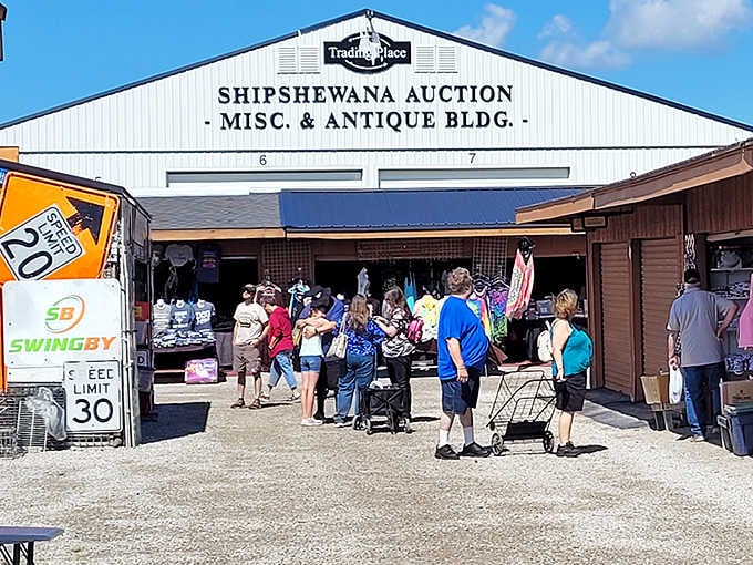 The crowd gathering at this auction building proves that bargain hunting is absolutely a spectator sport worth watching.
