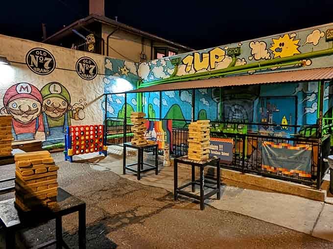 Giant Jenga and Mario murals transform this patio into a playground where grown-ups rediscover their inner kid between pizza slices.