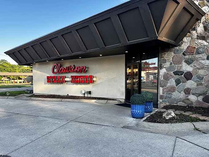 Classic red lettering on stone announces a steakhouse that's been perfecting its craft for generations of hungry diners.