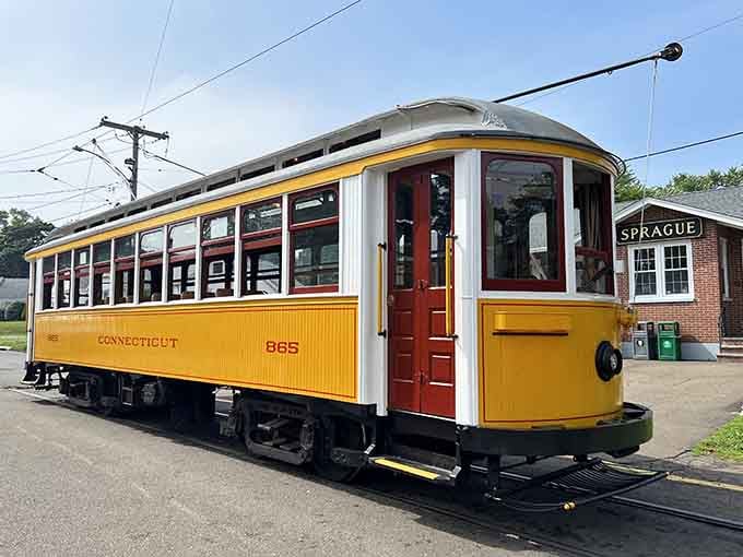 That cheerful yellow trolley car looks like it rolled right out of a Norman Rockwell painting, doesn't it?