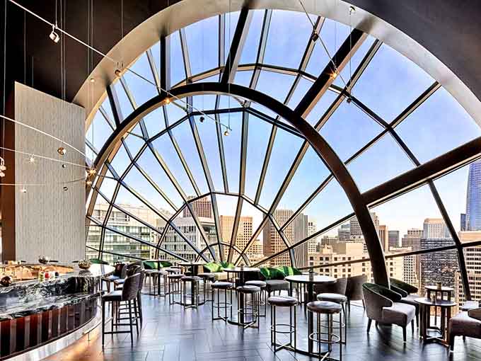 That dramatic curved window isn't just architecture&mdash;it's your personal frame for the entire city skyline.