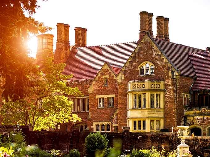 Golden hour transforms this English manor into something from a Masterpiece Theatre opening sequence.