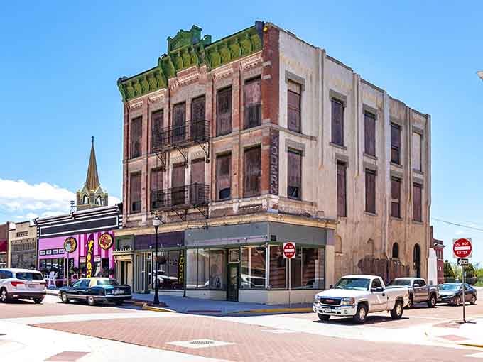 That weathered corner building has witnessed decades of stories, standing proud like a veteran at a reunion.