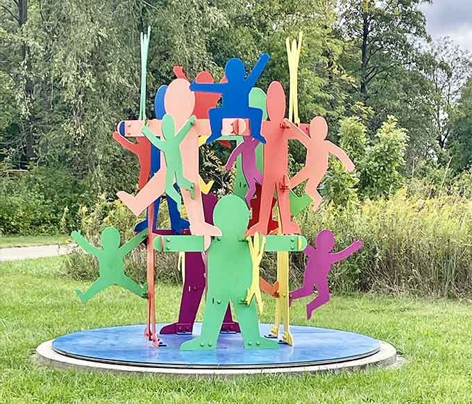 Colorful cutout figures stacked together celebrate community and connection in the most joyful, vibrant way imaginable.