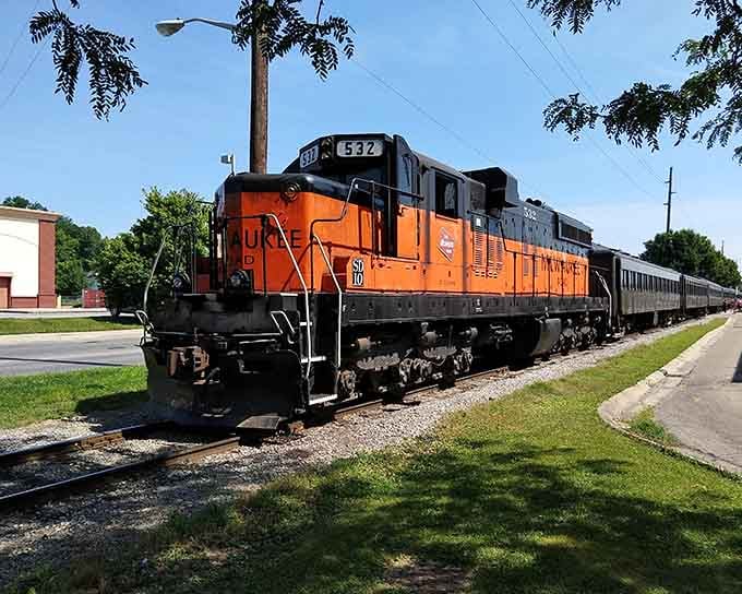 Bold orange stripes make this diesel locomotive impossible to miss, like a tiger prowling through small-town America.