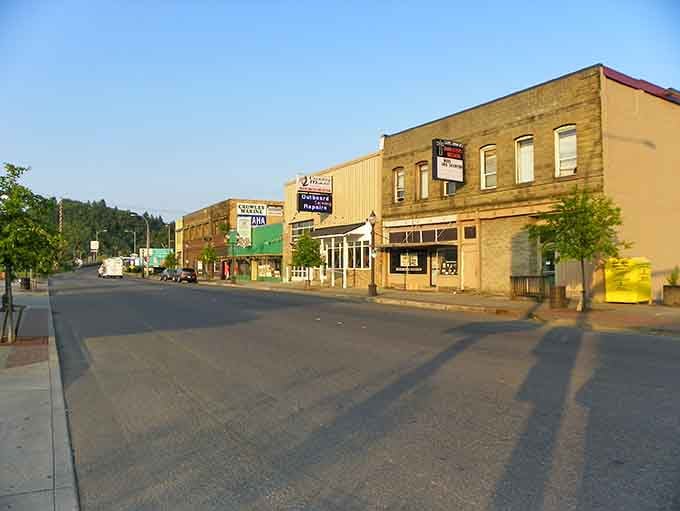 Golden hour transforms this main street into something magical, where every building glows with warmth and welcoming character.