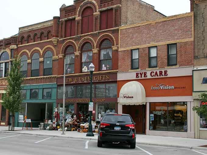 Ornate arched windows and vintage storefronts create a streetscape worthy of any classic American postcard.