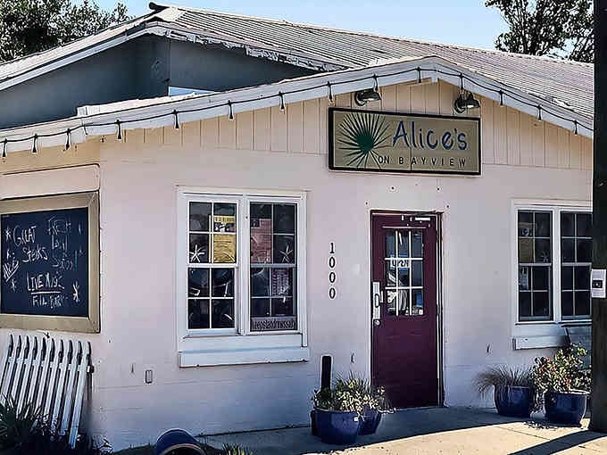 That welcoming entrance with potted plants says "come on in" better than any hostess ever could at brunch.