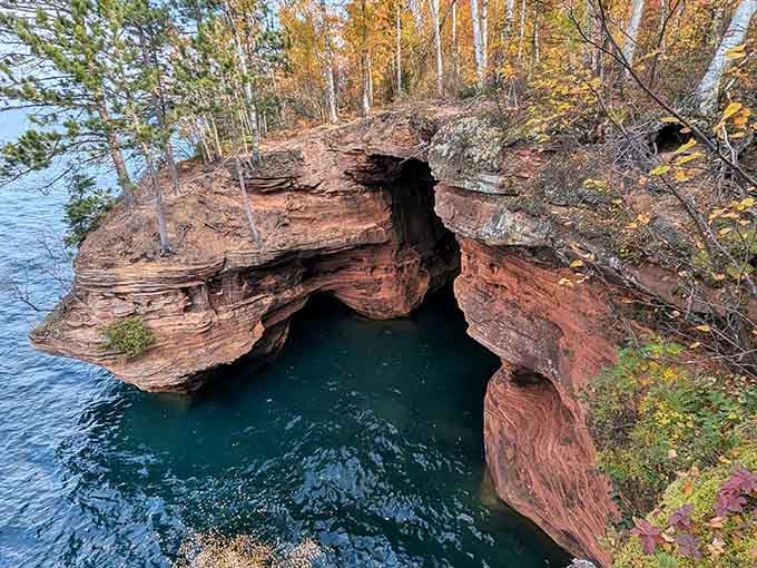 The arches and hollows reveal layers of geological history painted in shades of amber and crimson.