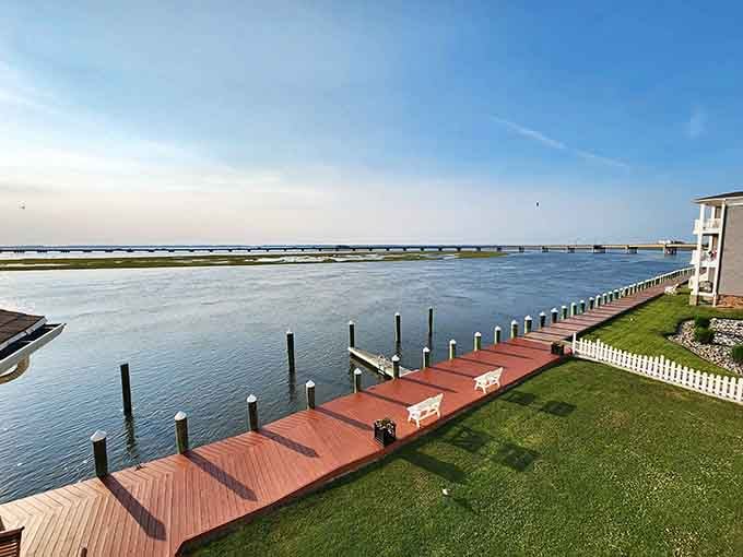 That long bridge stretching across calm waters promises adventure, while manicured lawns invite you to simply sit and breathe.