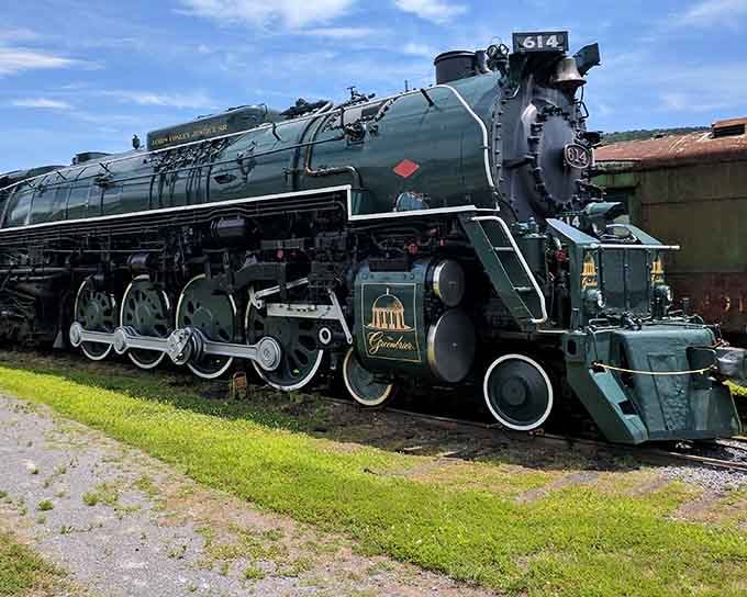 This magnificent steam engine's massive wheels and polished green body command respect like a Sherman tank at a car show.