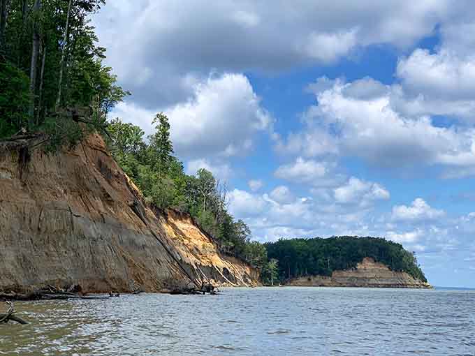 Towering sediment walls meet the Chesapeake, revealing ancient secrets with every wave that rolls in.