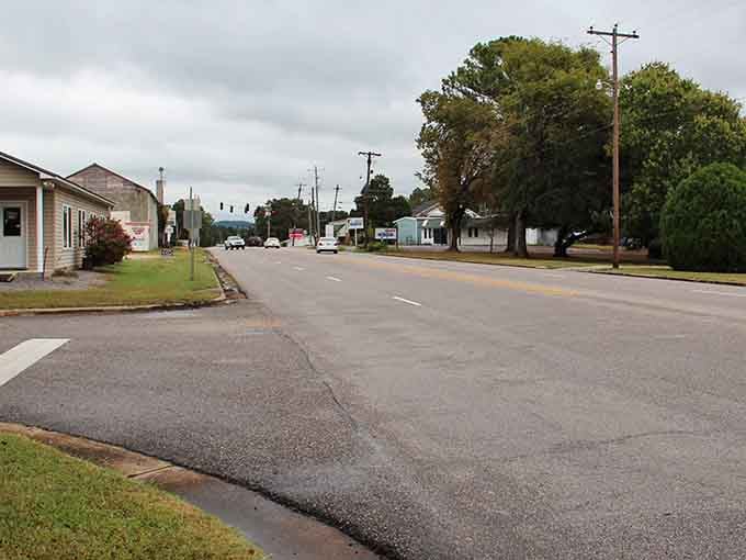 Wide-open streets and towering trees frame a town where rush hour means three cars at the stoplight.