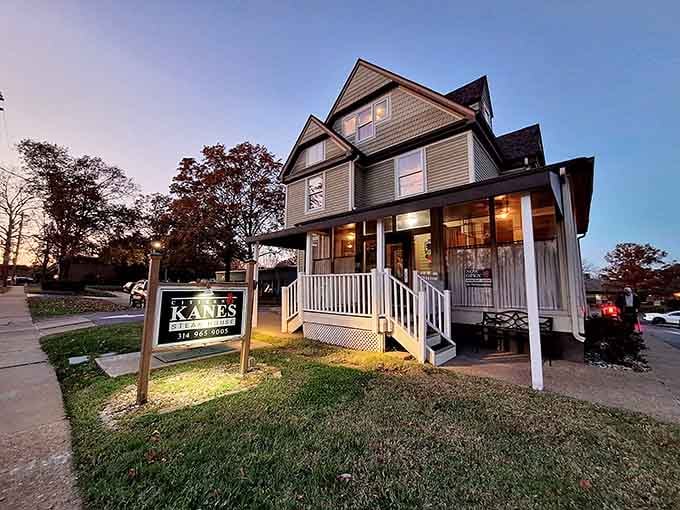 As twilight settles over this charming porch, the warm windows hint at the incredible beef waiting inside this historic beauty.