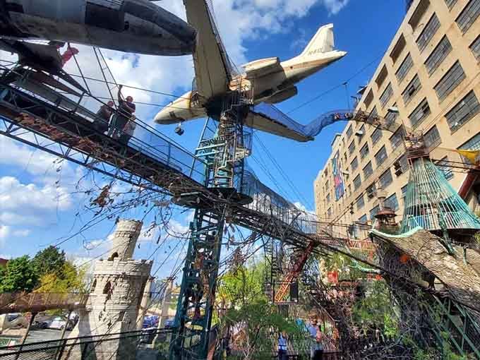 Suspended planes and twisted metal tunnels create a skyline that looks like Dr. Seuss designed a city.
