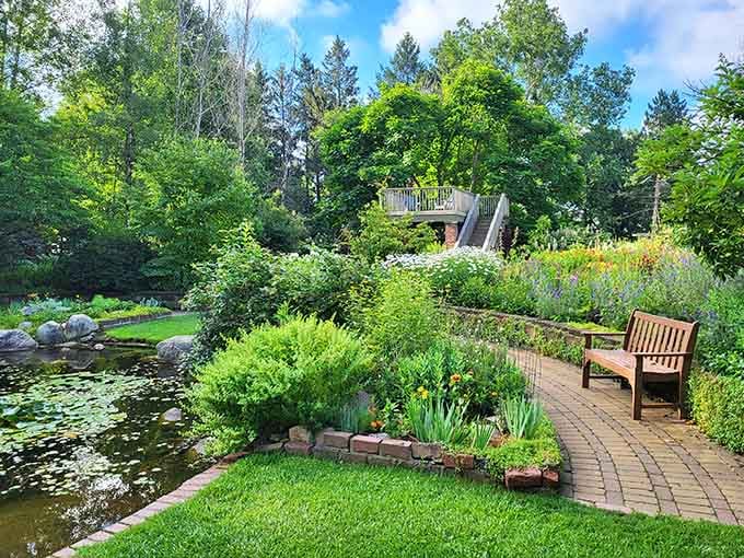 That wooden bench beckons you to sit and contemplate the lily pads while nature performs its quiet symphony.