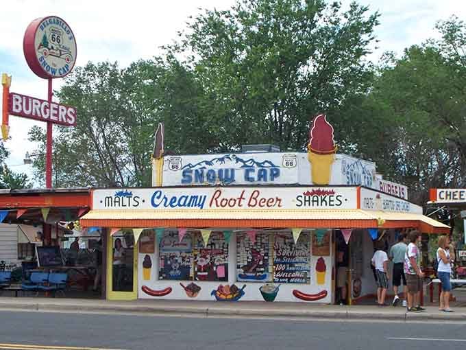 That giant ice cream cone on the roof promises sweet treats beneath summer skies and leafy trees.