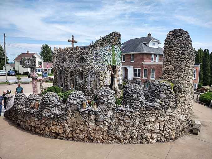 Every surface tells a story here, where colorful glass and river rocks transform into architectural poetry.