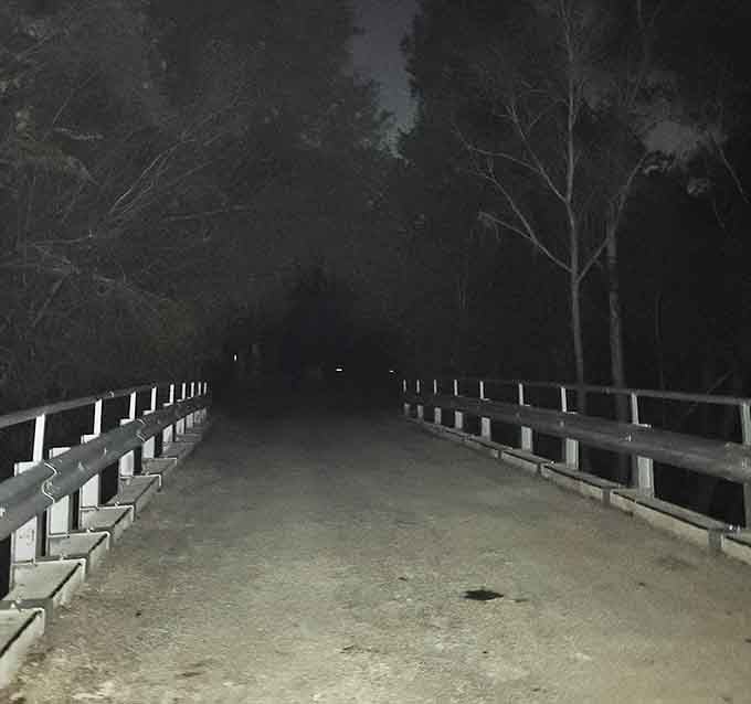 When night falls here, those white railings are your only guide through the legendary Donkey Lady's domain.