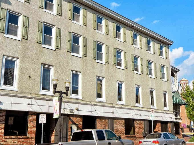 This historic Elkton building stands tall with shuttered windows, quietly watching over Main Street like it has for generations.