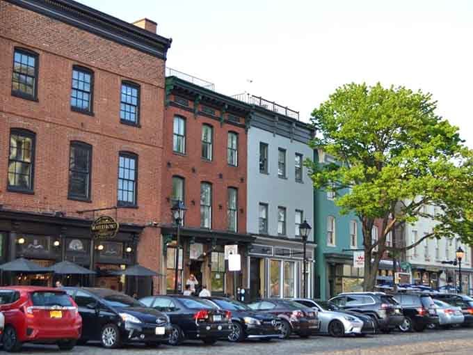 Pastel row houses huddle together like old friends sharing secrets, each one more charming than the last neighbor.