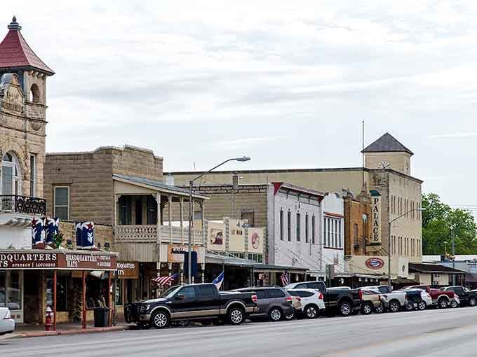 These weathered stone buildings and vintage clock tower create a streetscape that cameras absolutely adore every single time.