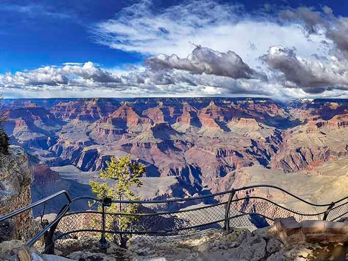 Those dramatic clouds rolling over endless canyon layers prove nature's the real artist here, no filter needed whatsoever.