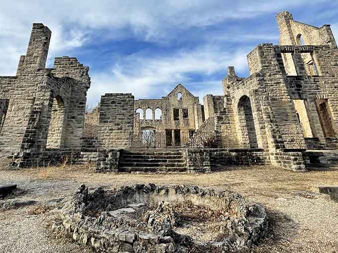 These haunting arched windows frame the Ozarks perfectly, standing proud despite fire's attempt to write their final chapter decades ago.