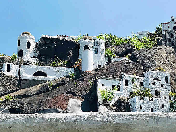 These pristine white buildings cascade down the hillside like a Mediterranean dream dropped into New England.