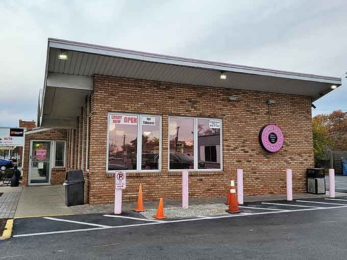 The cheerful pink accents and welcoming entrance promise the kind of neighborhood bakery experience your grandparents would have loved.