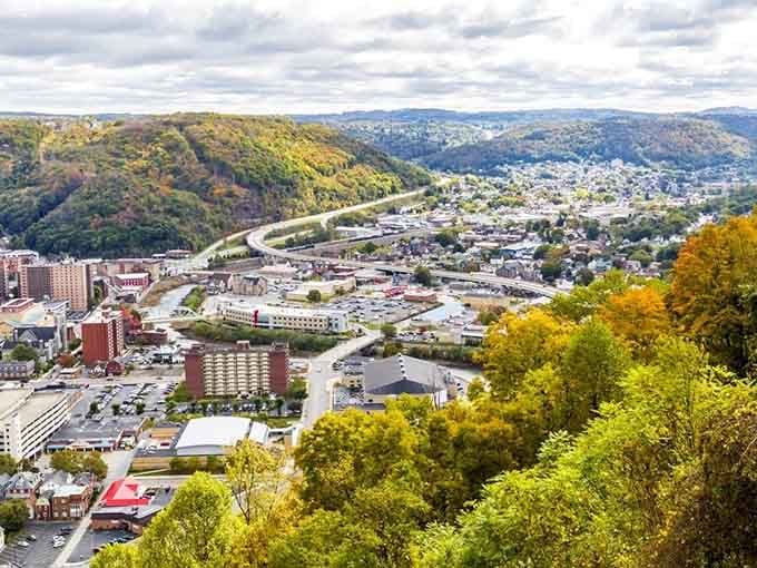 Mountains embrace this valley town in a hug you can actually see from above, nature's perfect retirement backdrop.