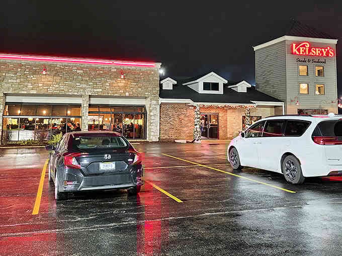 Rain or shine, those glowing windows promise warmth, sizzling steaks, and the kind of meal worth driving through weather for.