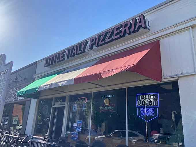 The Italian flag awning waves proudly above Little Italy, where New York-style slices meet Southern hospitality beautifully.