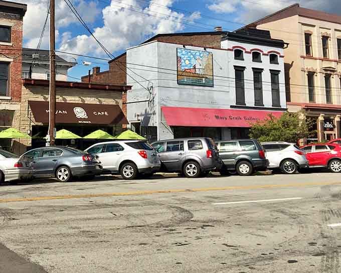 Colorful awnings pop against historic facades, proving that old buildings can still dress up for the occasion.