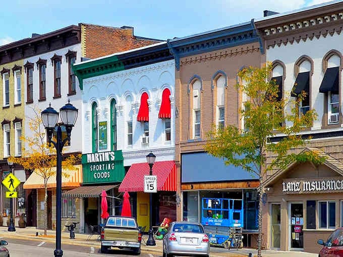 Ornate architectural details crown these storefronts, proving beauty doesn't require a big-city budget or attitude.