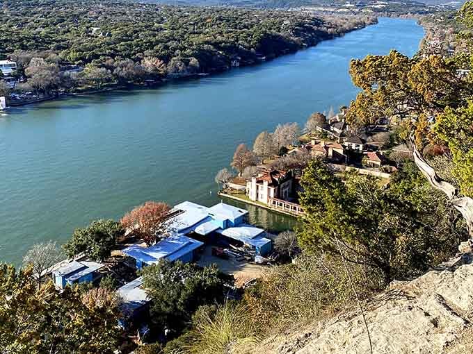 Lakeside homes nestle into the hillside below, creating a scene that belongs in a travel magazine's greatest hits.